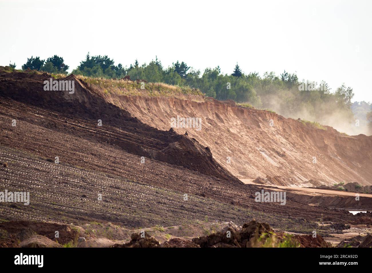 Reclamation of a sand pit. Artificial flattening of pit slopes Stock ...