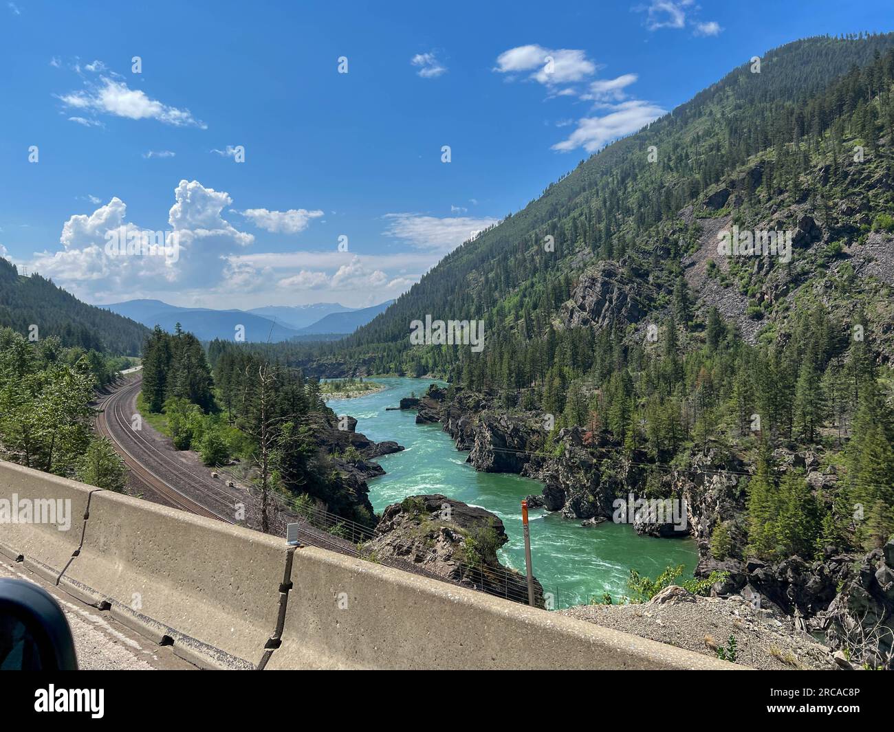 The mountains along the Kootenay River near Libby, MT on a bright sunny ...