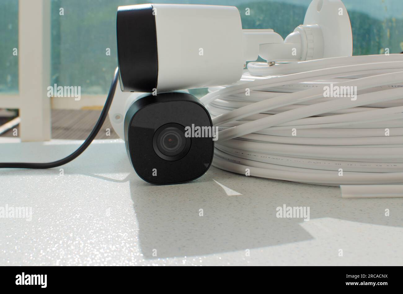 Detail of the security camera with a roll of wire, showing the ...