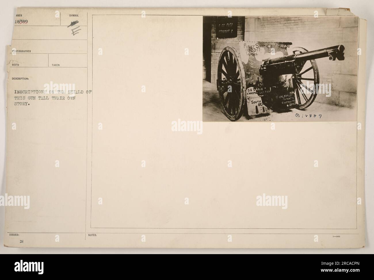 Title: American Soldier Examining Shield Inscriptions on a Gun Caption ...