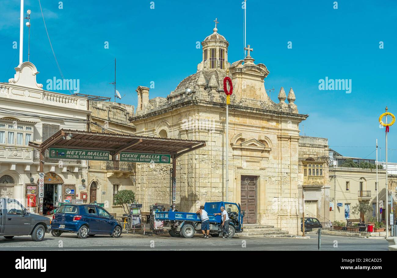 Petrol station next to the 18th-century St Mary chapel in the main ...