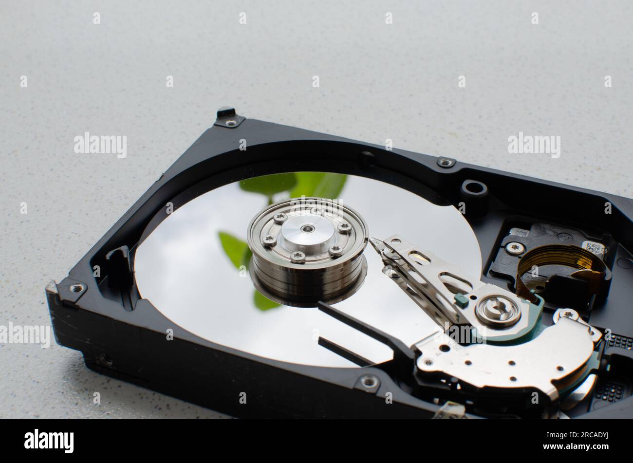 Close-up detail of a disassembled HDD, showing its internal structure ...