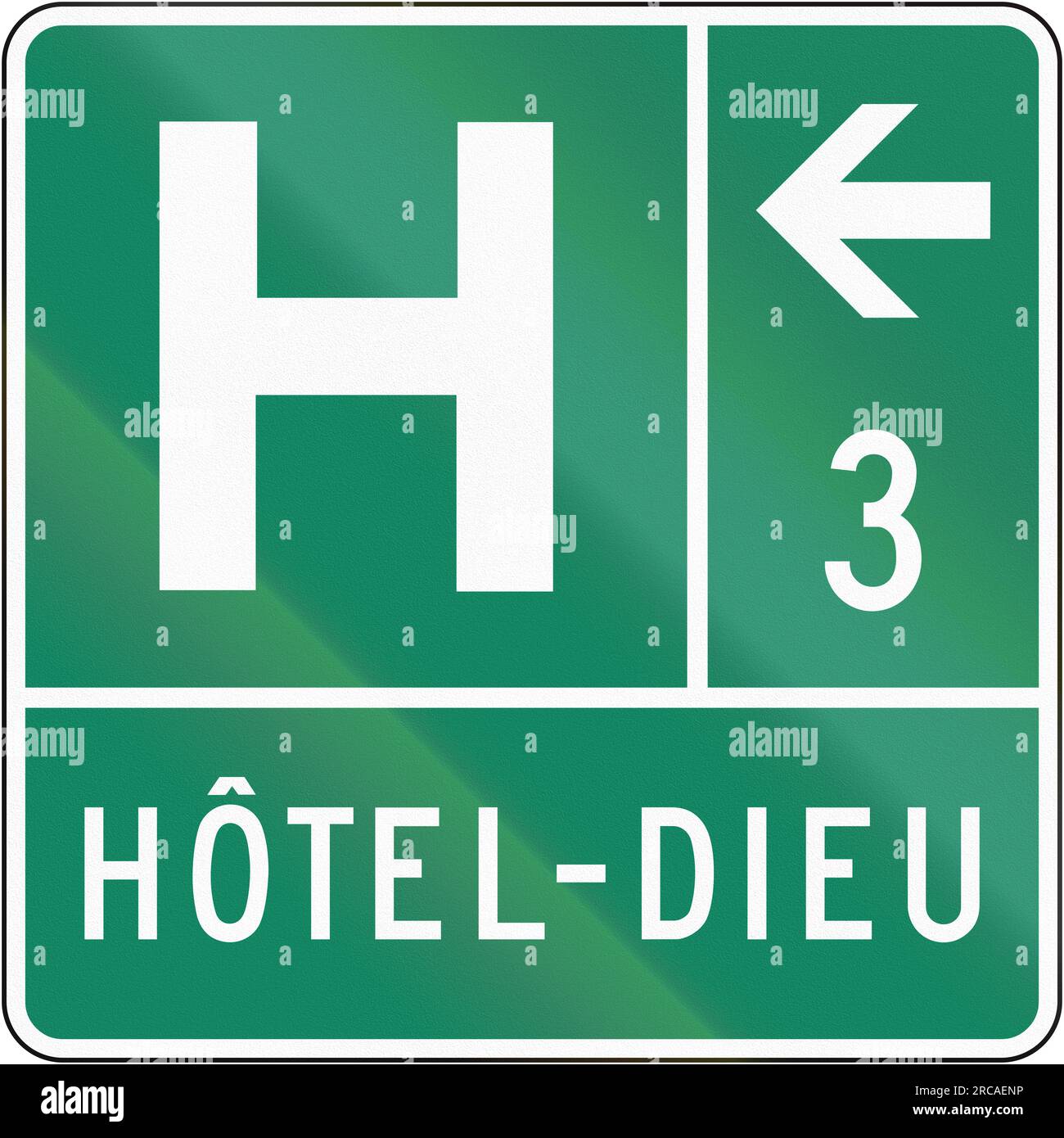 Guide sign in Quebec, Canada - Hospital on the left. The text means ...