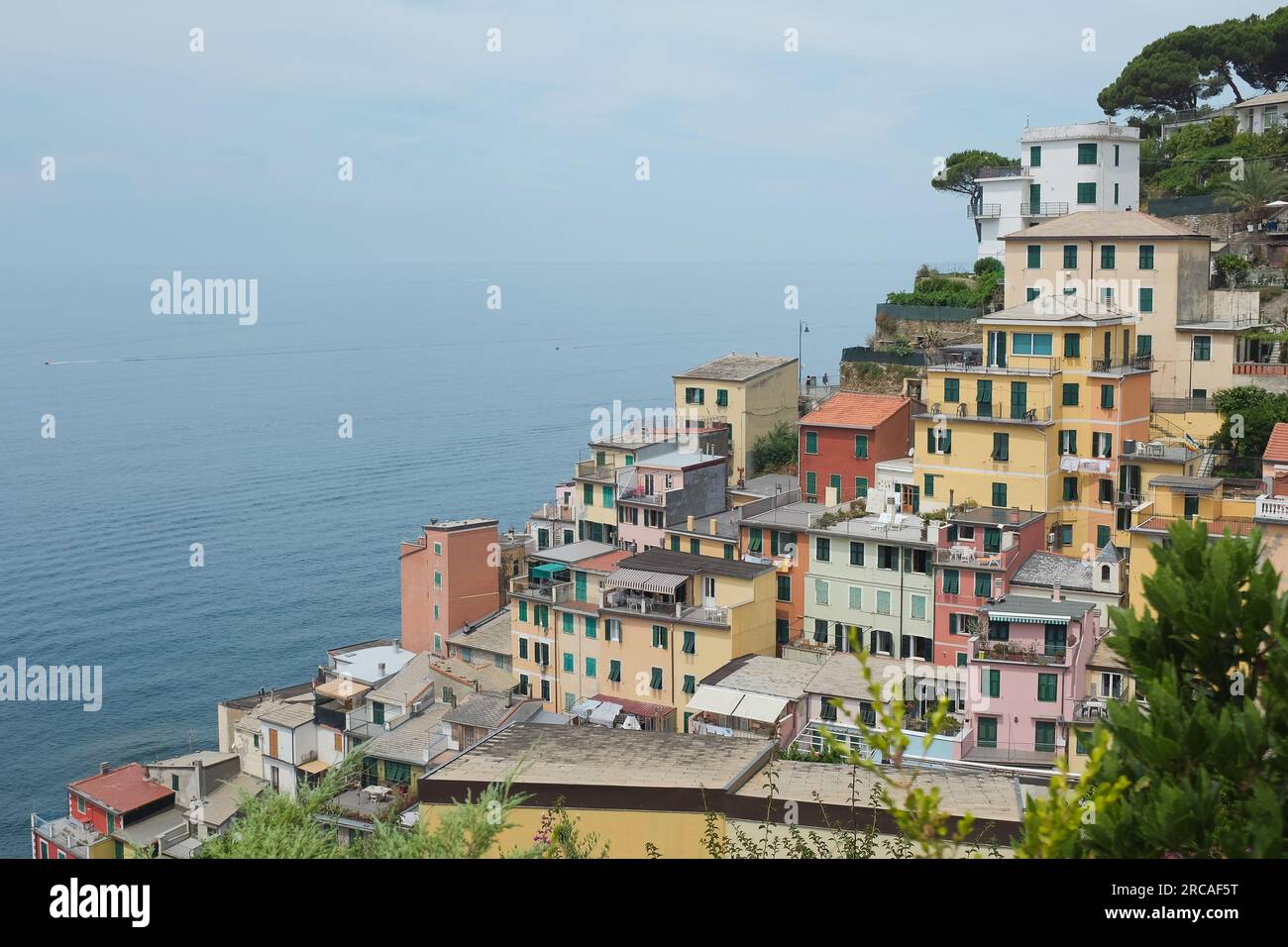 Cinque Terre, Italy - view of sea and colorful houses in Riomaggiore, a seaside town on the ...