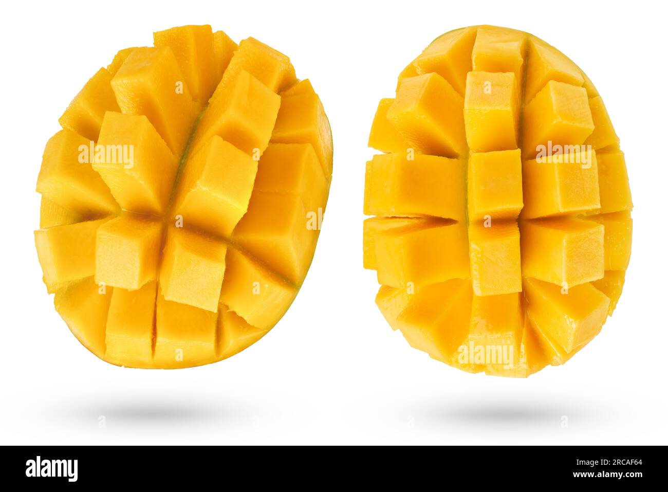 A couple of ripe sliced mangoes on a white isolated background. Ripe ...