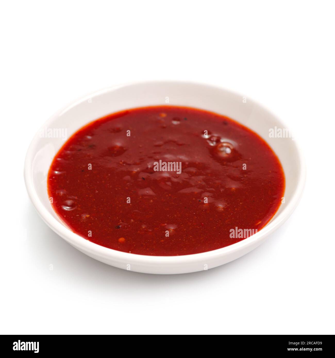 Kimchi sauce in a bowl on a white background. For the restaurant menu ...