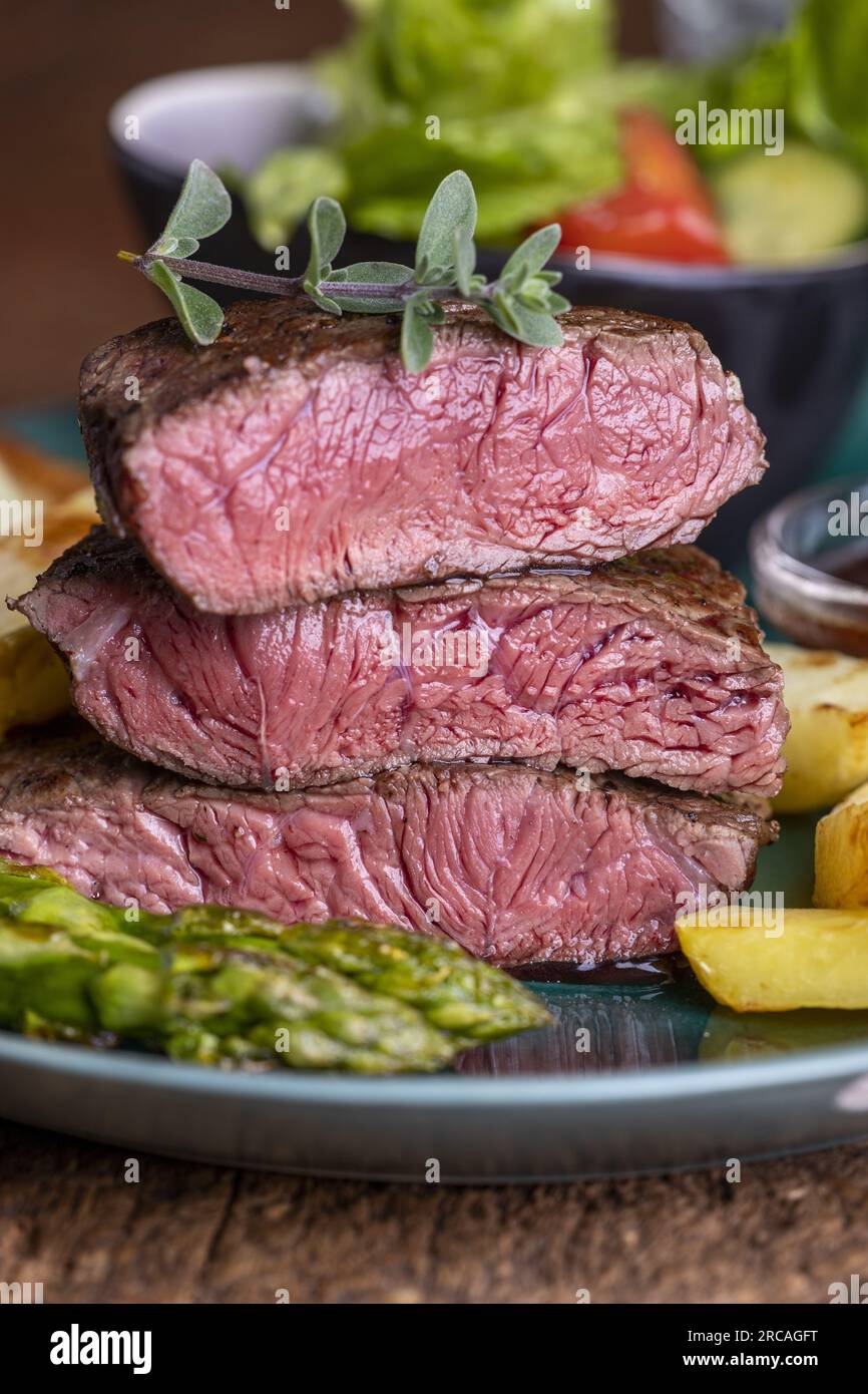 Steak With Asparagus And Fries Stock Photo - Alamy