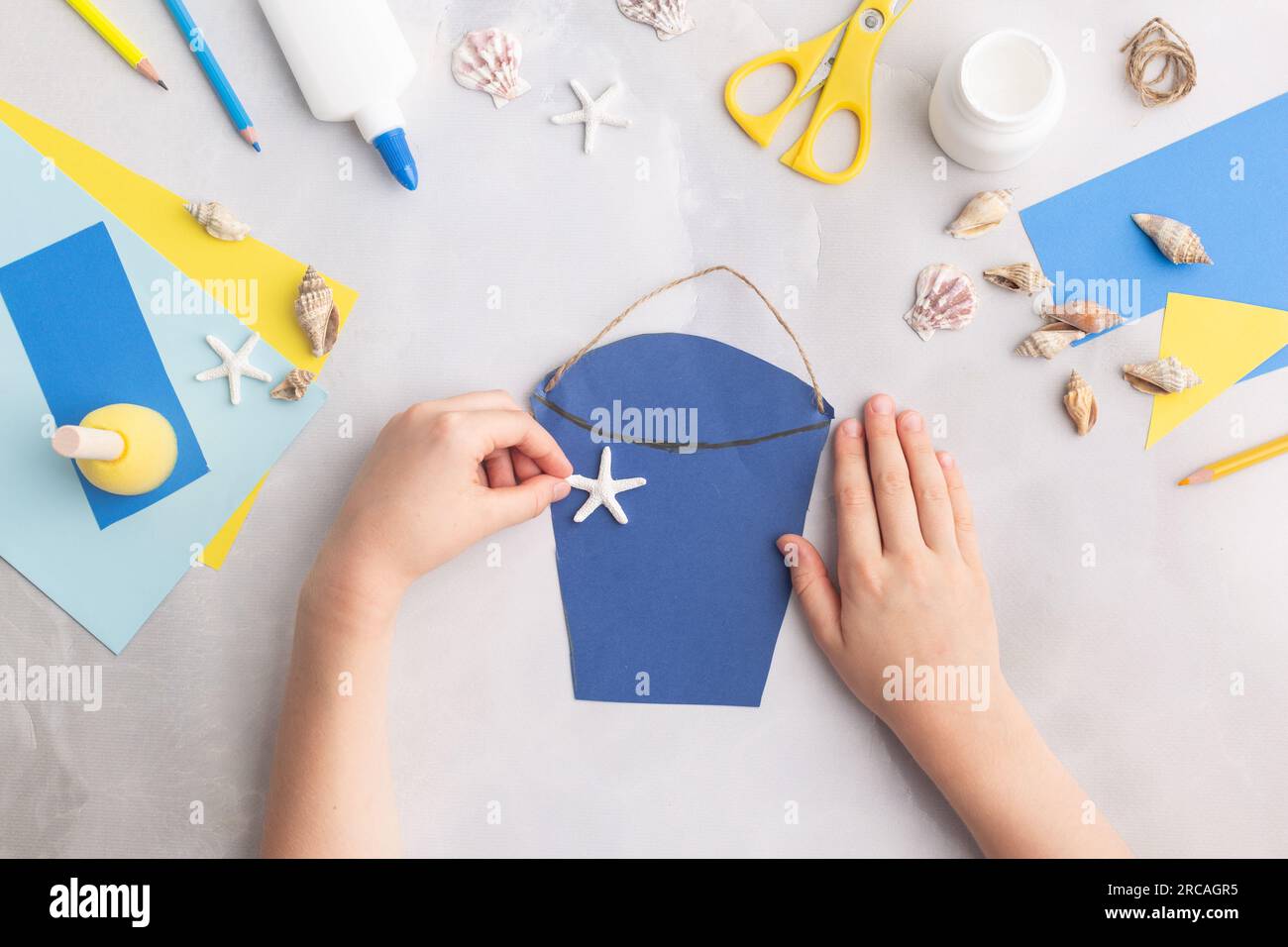 Paper bucket of shells summer idea for kids craft in kindergarten hands ...