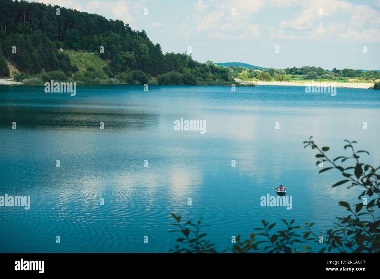 happy man lays down on supboard sunbathing Stock Photo - Alamy