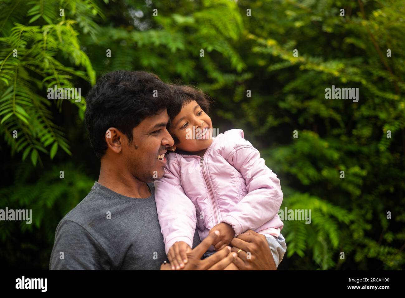 A heartwarming photo of an Indian father and daughter smiling and ...