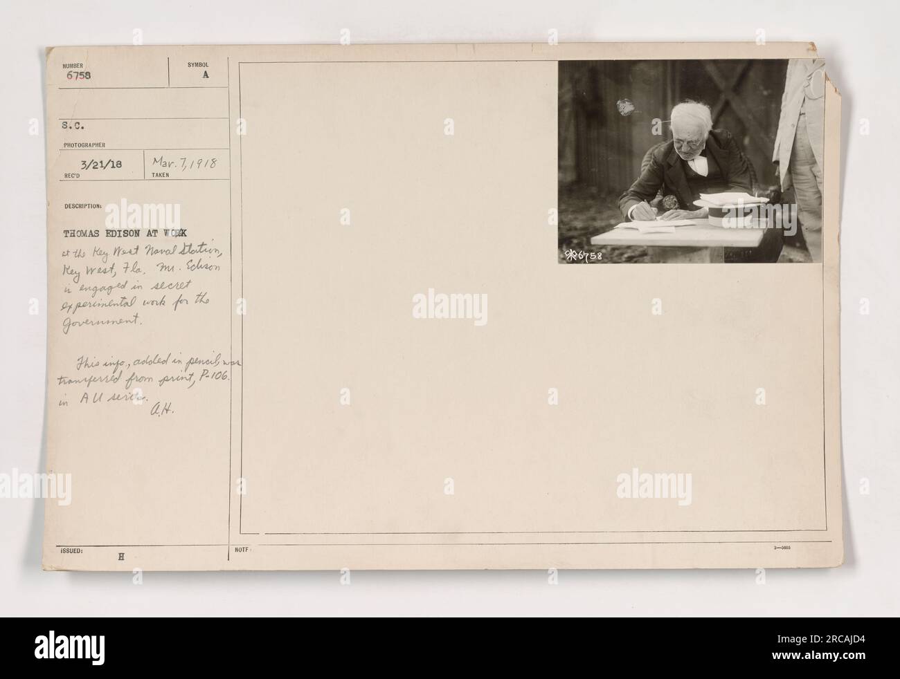 In this photograph, Thomas Edison can be seen at his desk, writing. The ...