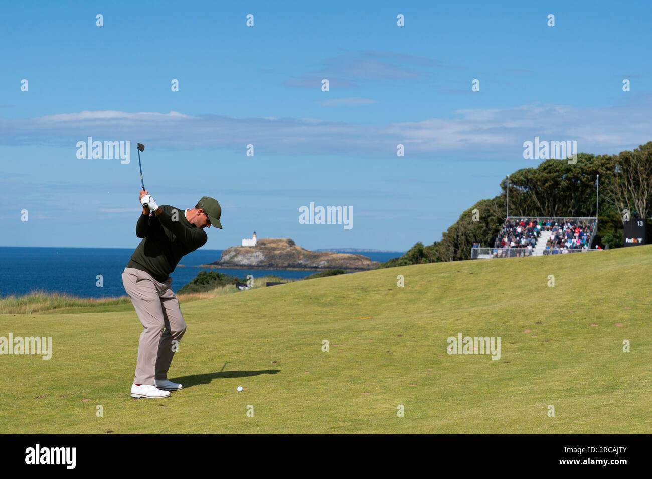 North Berwick, East Lothian, Scotland, UK. 13th July 2023. Adam Scott plays his approach to the ...