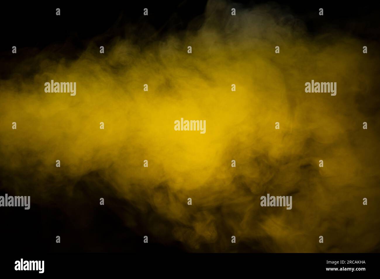 Yellow steam on a black background. Copy space Stock Photo - Alamy