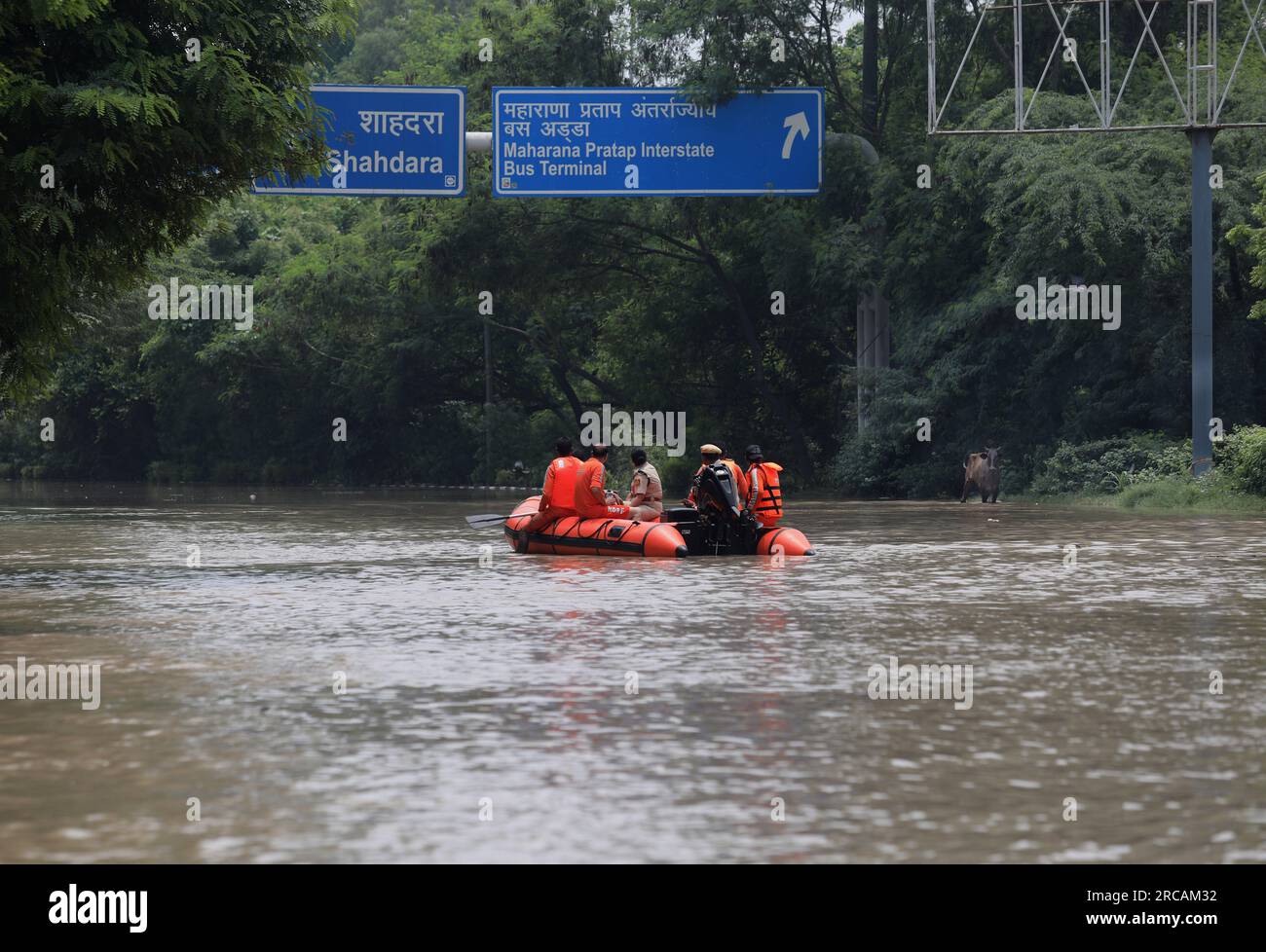New Delhi, India. 13th July, 2023. National Disaster Response Force (NDRF) personnel trying to ...