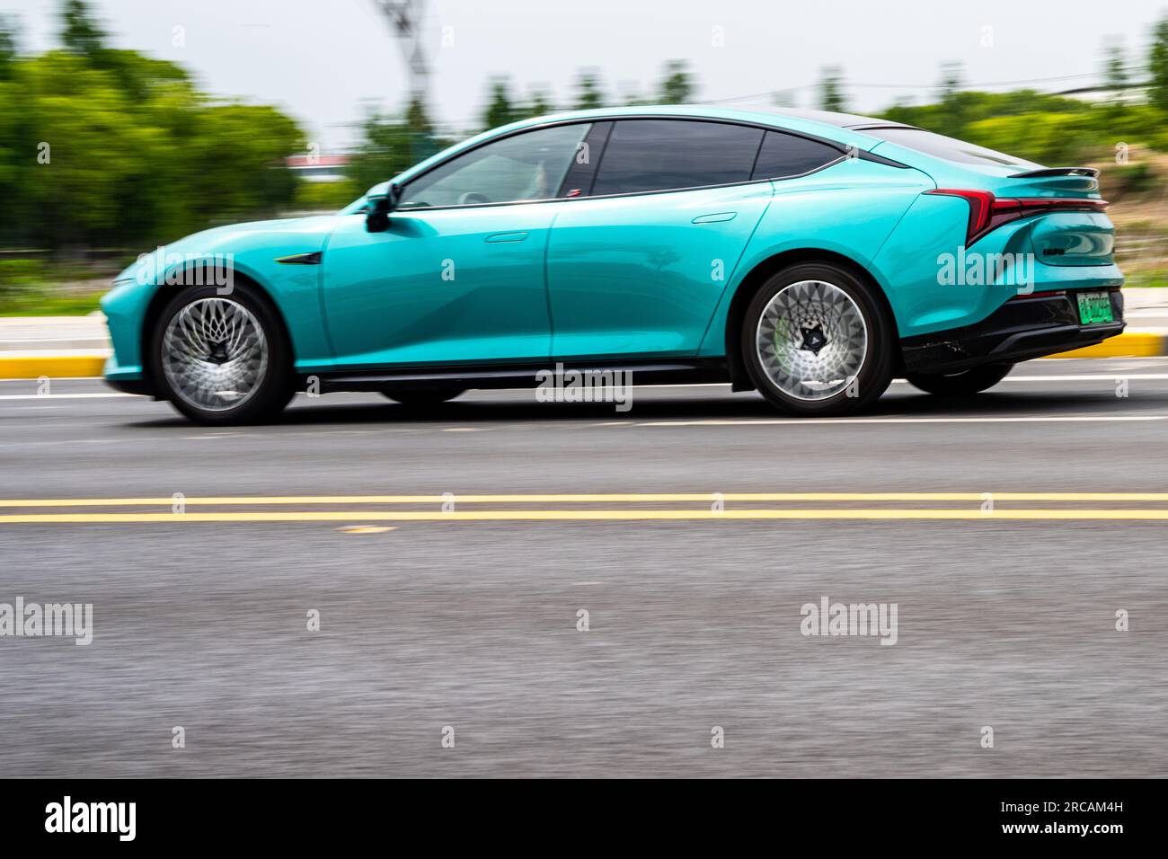 An electric Neta S sedan, from a Chinese EV startup, driving by in ...