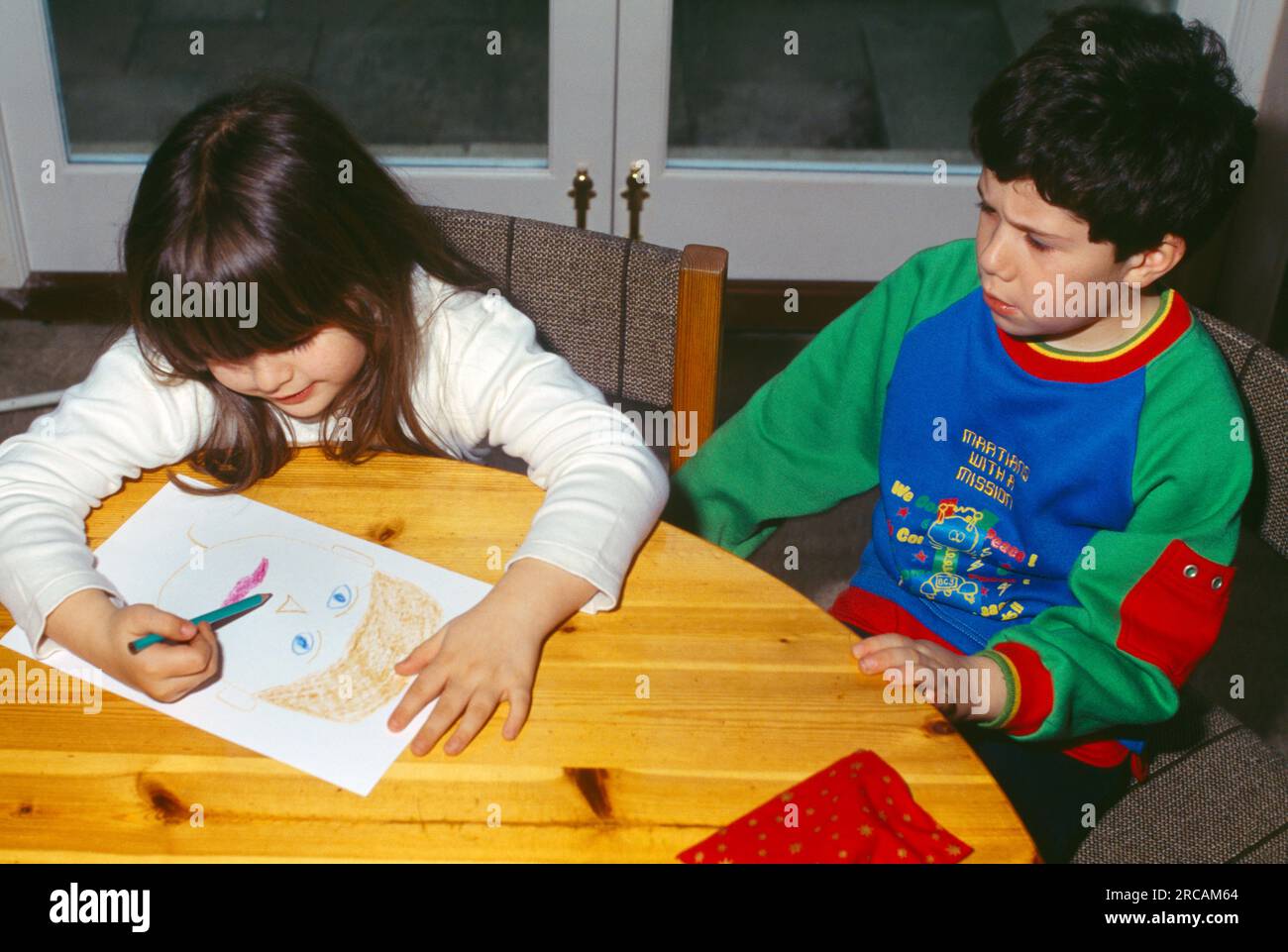 Girl Drawing Friend Working Together Surrey England Stock Photo - Alamy
