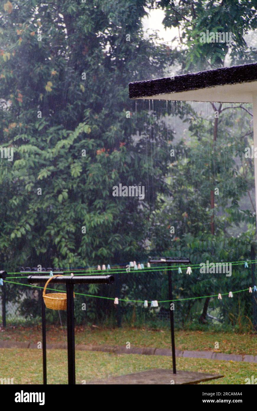 Singapore Empty Washing Line in Heavy Rain Monsoon Stock Photo - Alamy