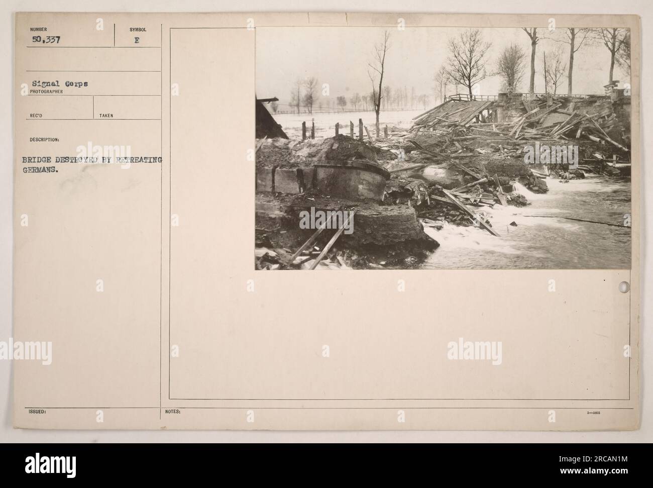 Caption for the image: Bridge destroyed by retreating German forces ...