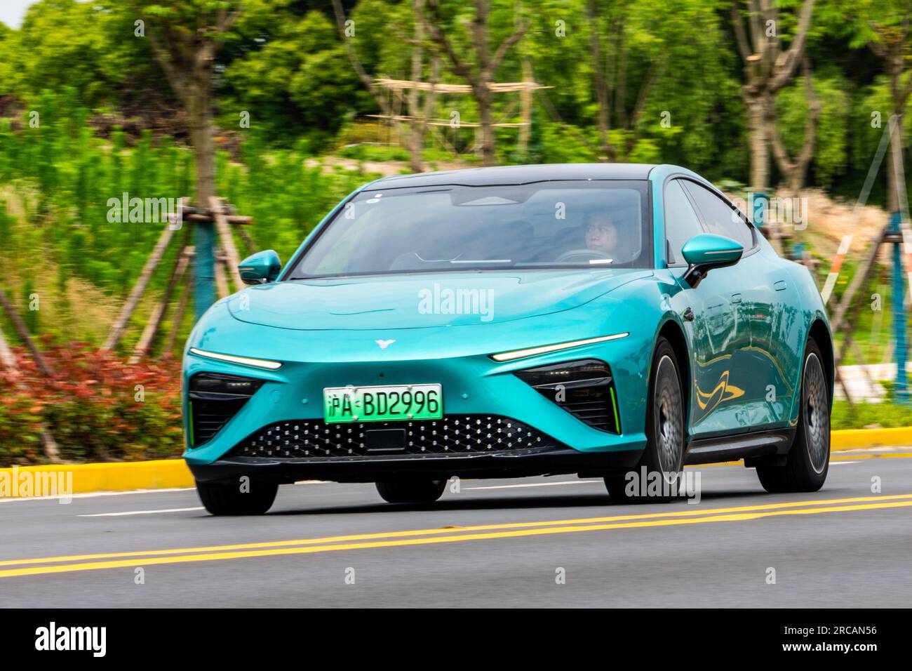 An electric Neta S sedan, from a Chinese EV startup, driving by in ...