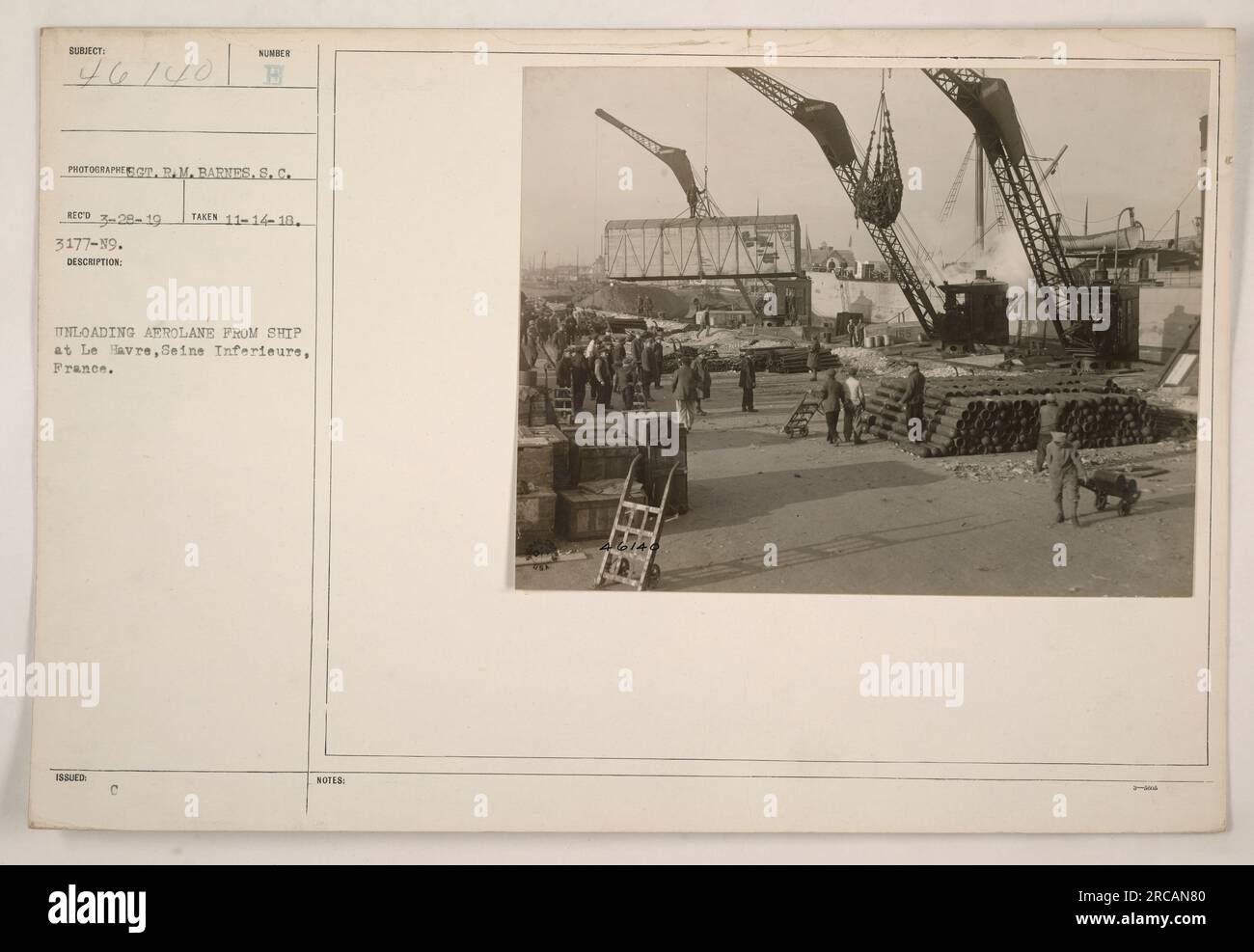 American military personnel unloading an airplane from a ship at Le ...