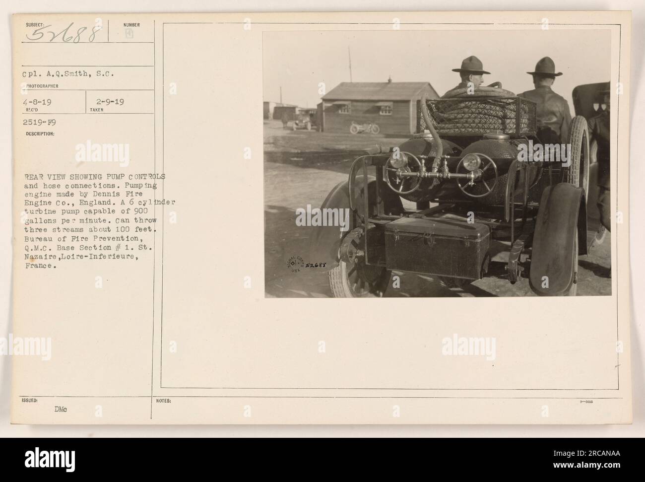 Rear view of a pumping engine showing pump controls and hose ...