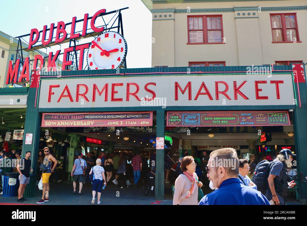 Farmers Market and Public Market signs and clock at Pike Place market ...