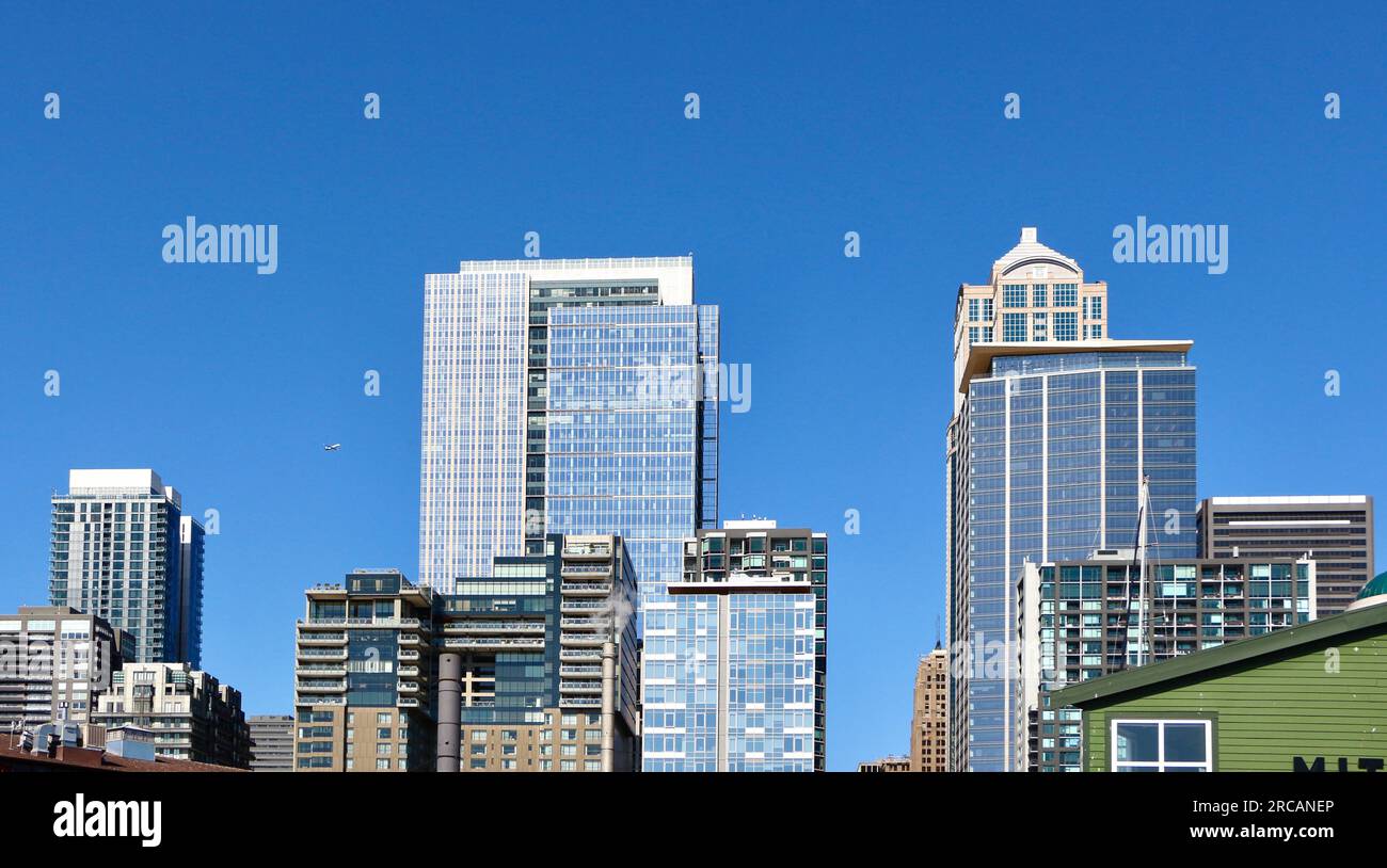 Skyscraper skyline view from the waterfront in strong sunshine Seattle ...