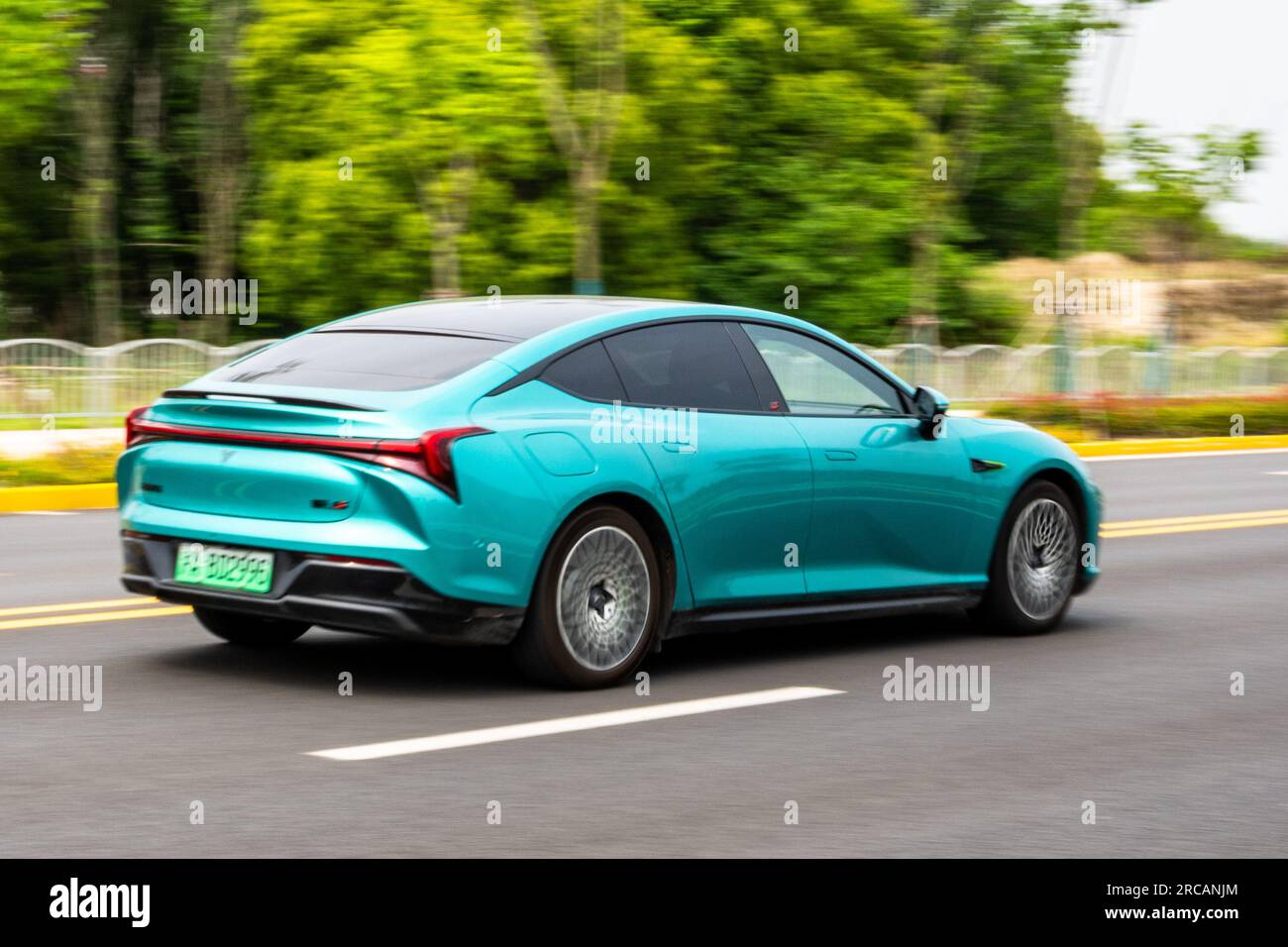 An electric Neta S sedan, from a Chinese EV startup, driving by in ...