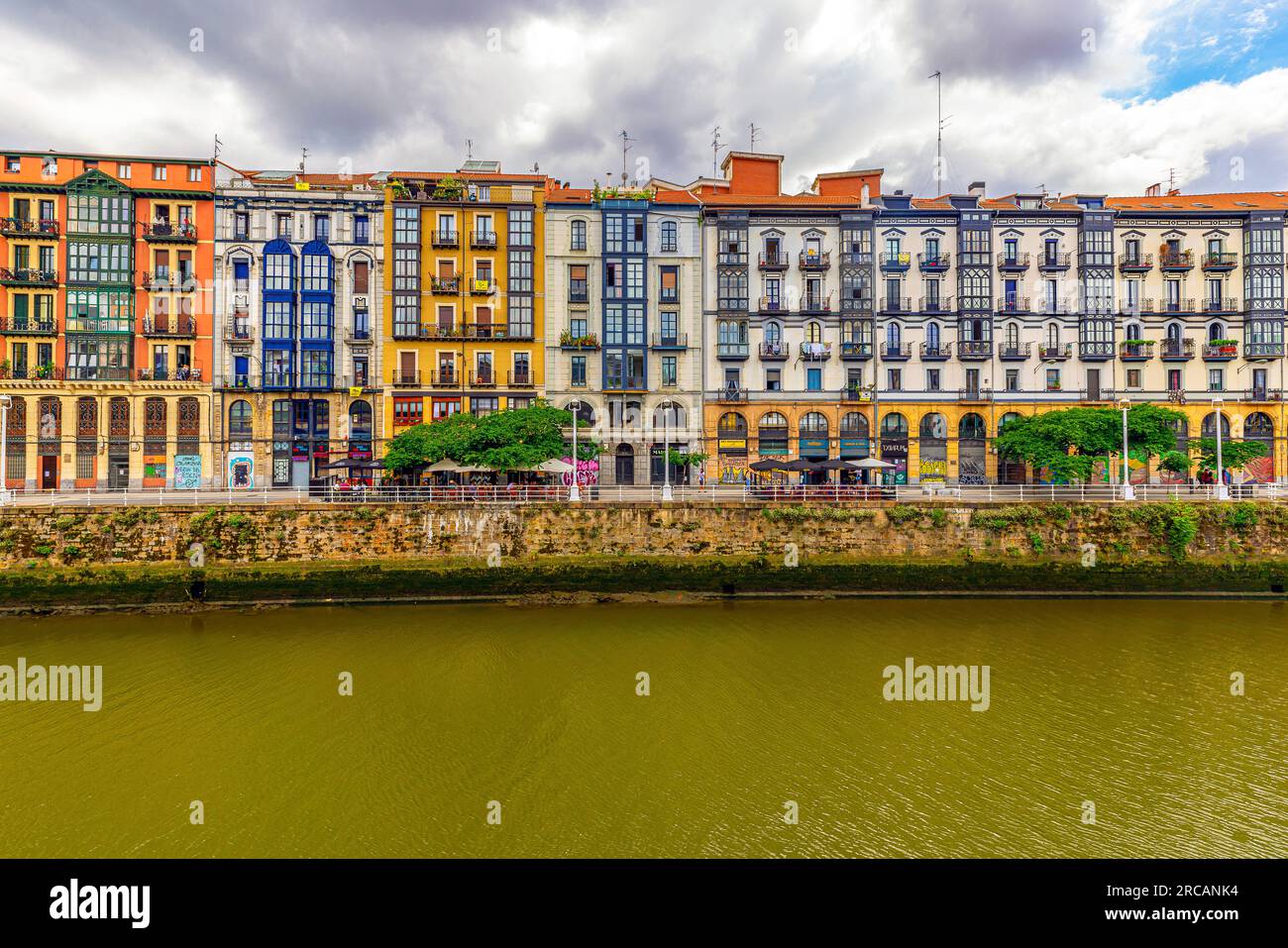 Colorful apartment buildings of the Nervion River In Bilbao, Basque ...