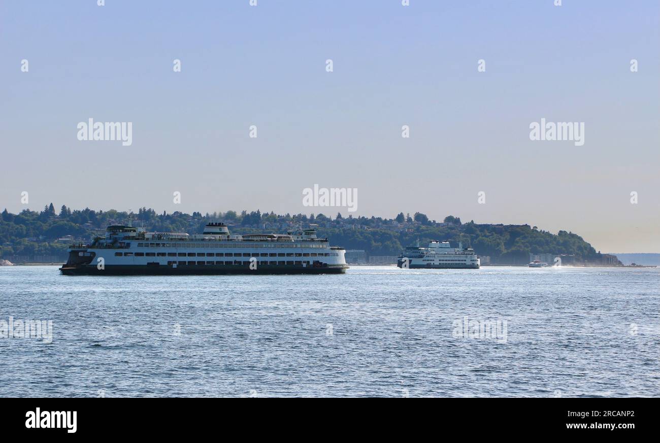 Walla Walla ferry passing the Suquamish ferry of Washington State ...