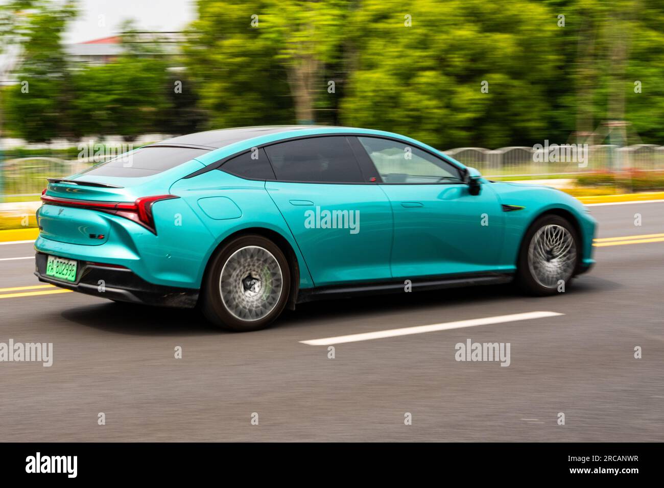 An electric Neta S sedan, from a Chinese EV startup, driving by in ...