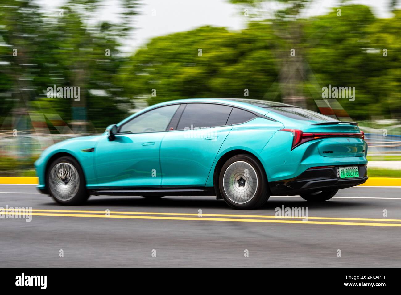 An electric Neta S sedan, from a Chinese EV startup, driving by in ...