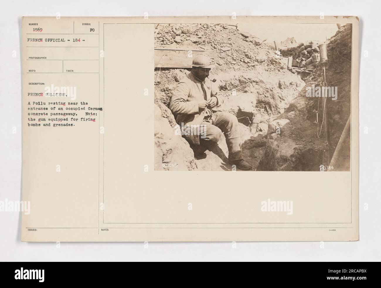 A French soldier, known as a poilu, takes a break near the entrance of ...