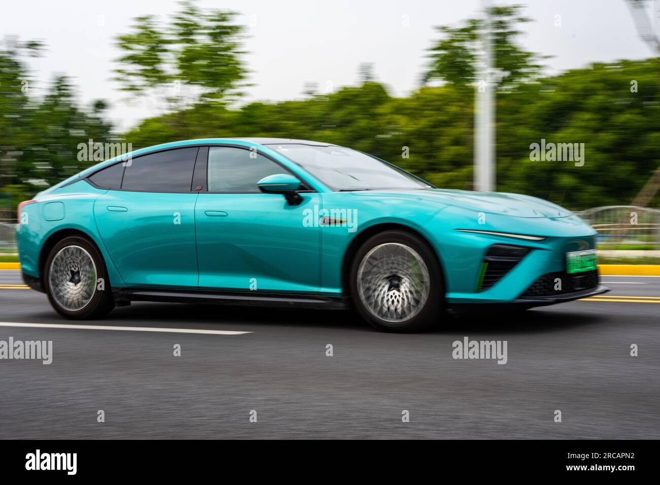 An electric Neta S sedan, from a Chinese EV startup, driving by in ...