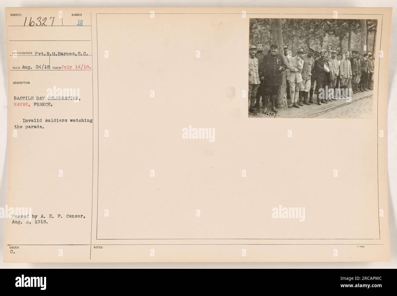 Invalid soldiers watch as a parade celebrates Bastille Day in Havre ...