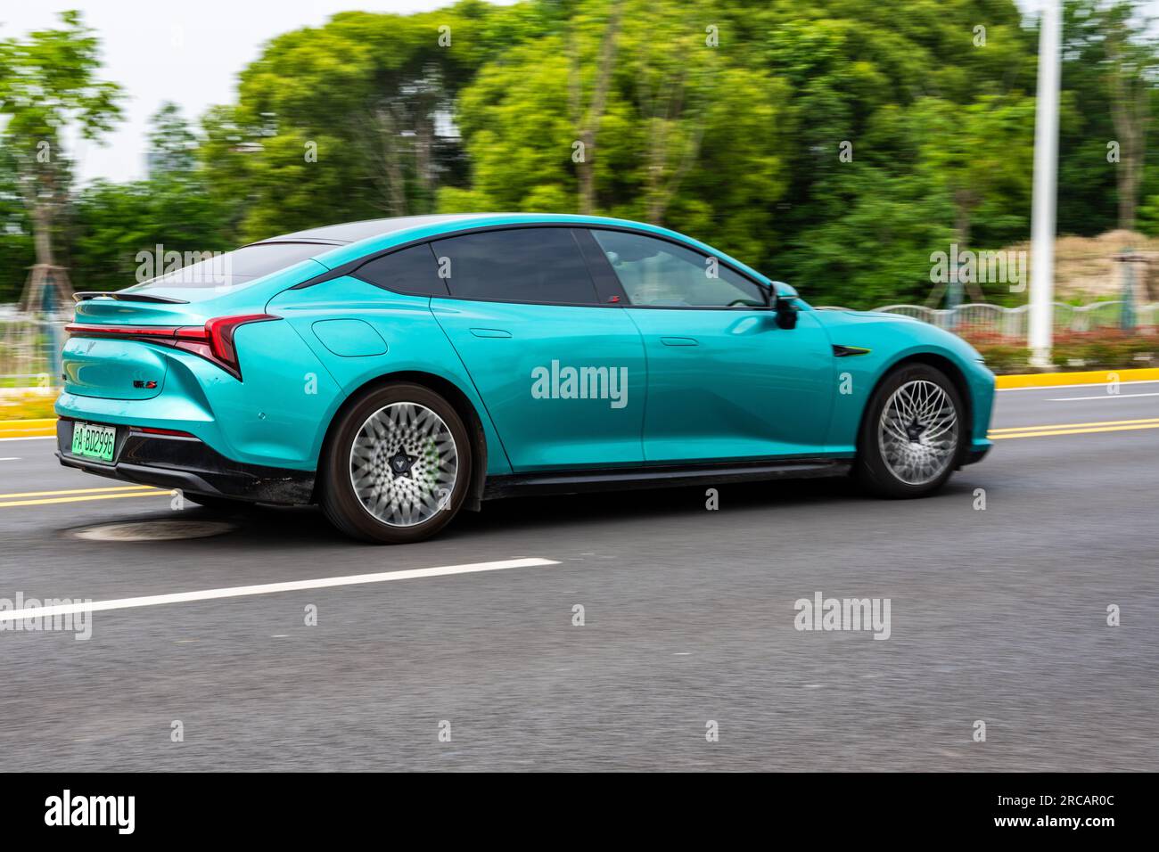An electric Neta S sedan, from a Chinese EV startup, driving by in ...