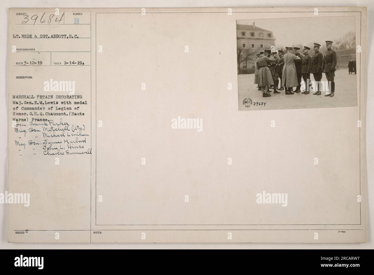 Lt. Rode and Sot. Abbott are pictured with Gen. Petain as he awards Maj ...
