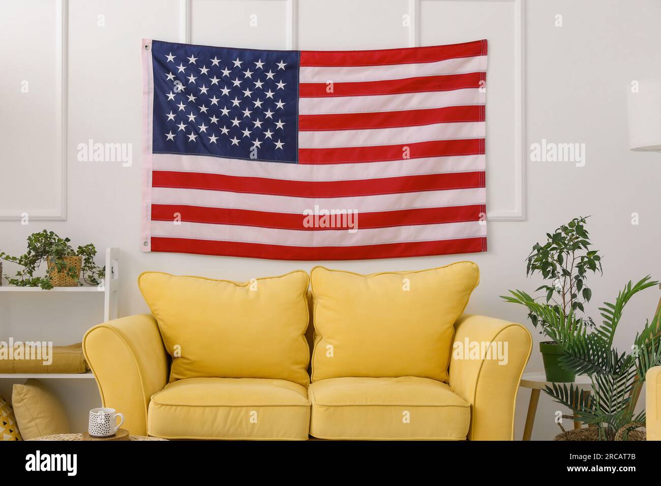 Interior of modern living room with hanging USA flag Stock Photo - Alamy