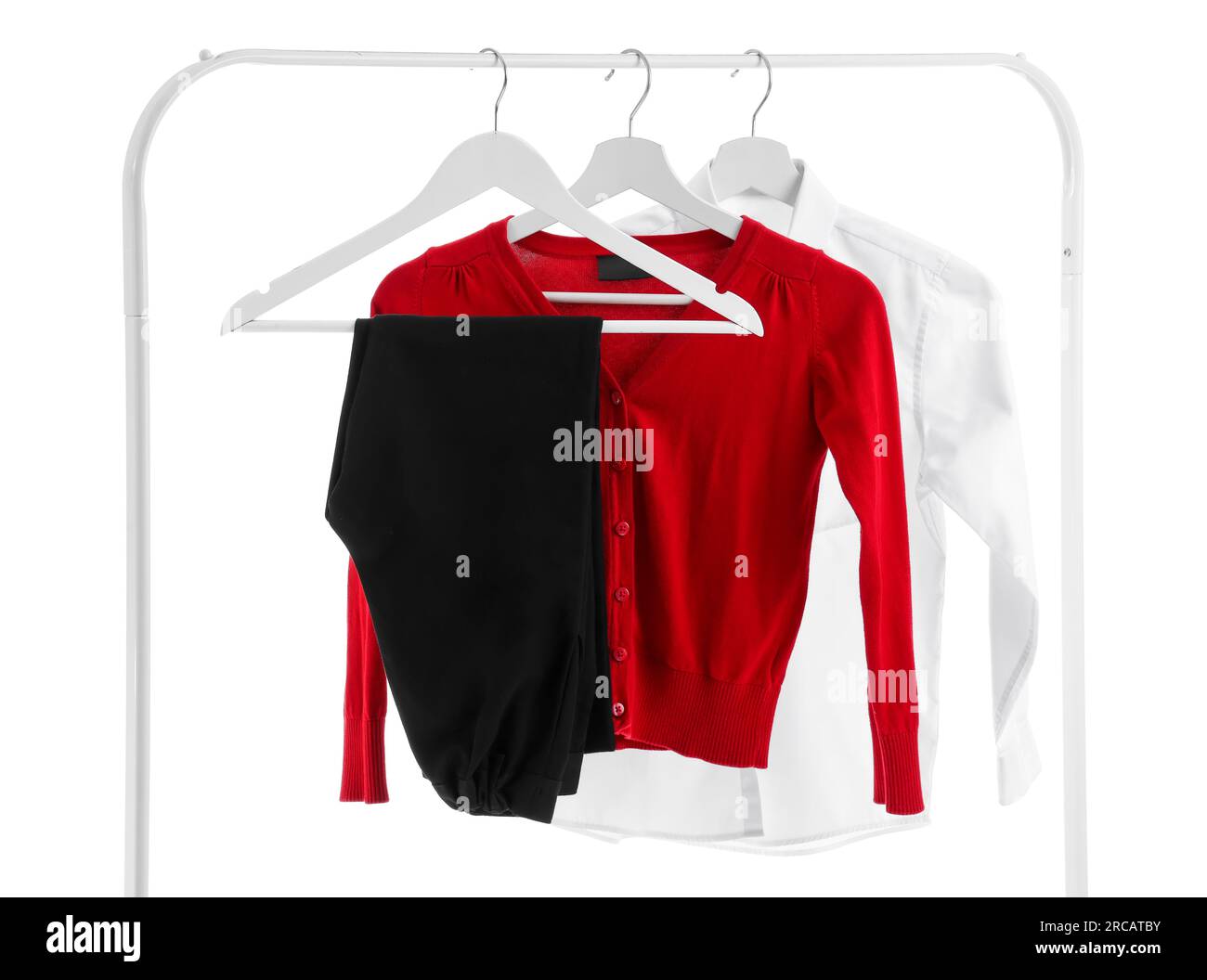 Rack with modern school uniform on white background Stock Photo - Alamy
