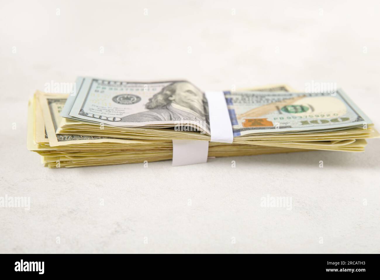 Bundles of dollar banknotes on light background Stock Photo - Alamy