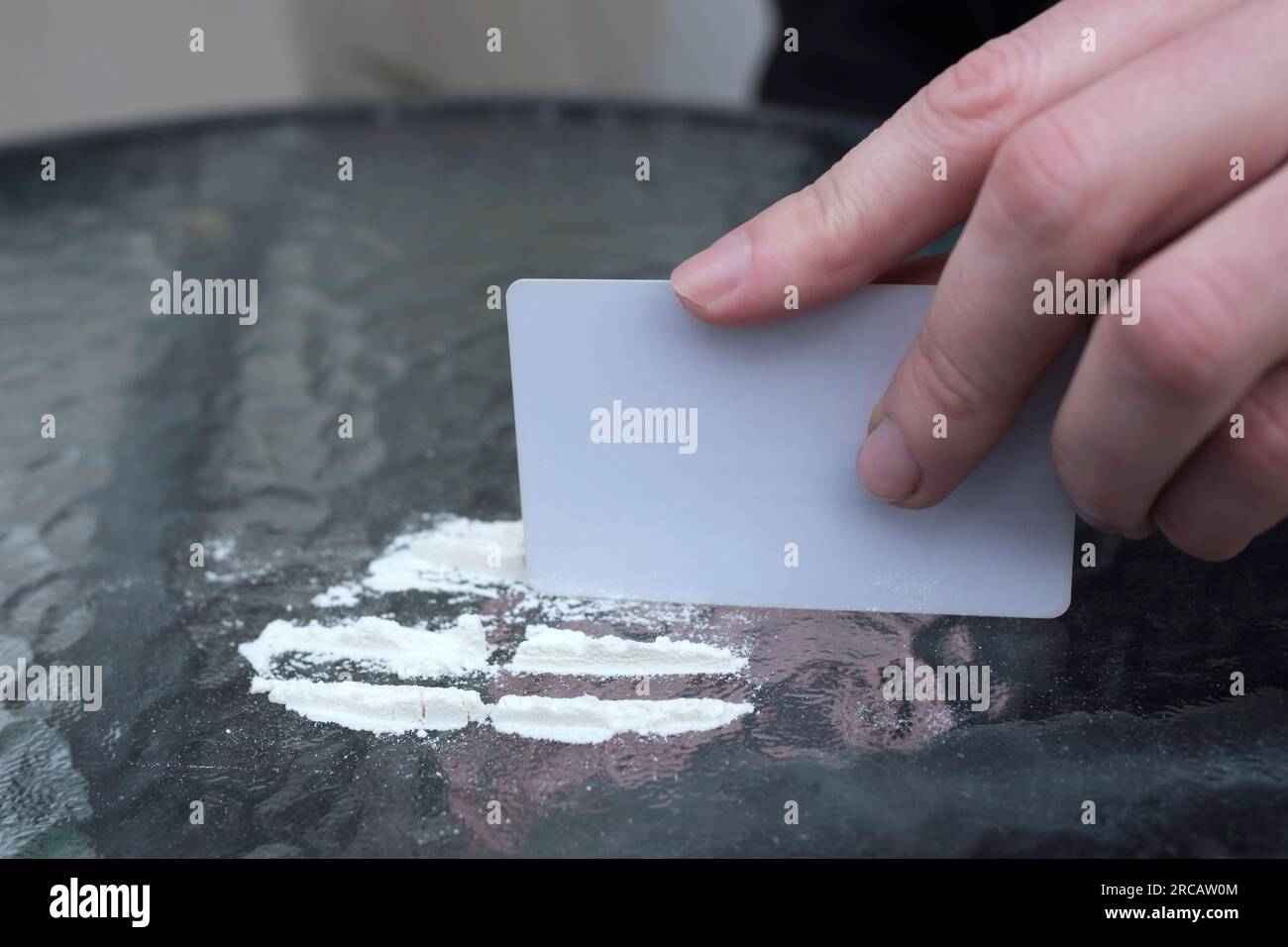 Dose of drugs and the hand of an addict, close-up. Addiction concept ...