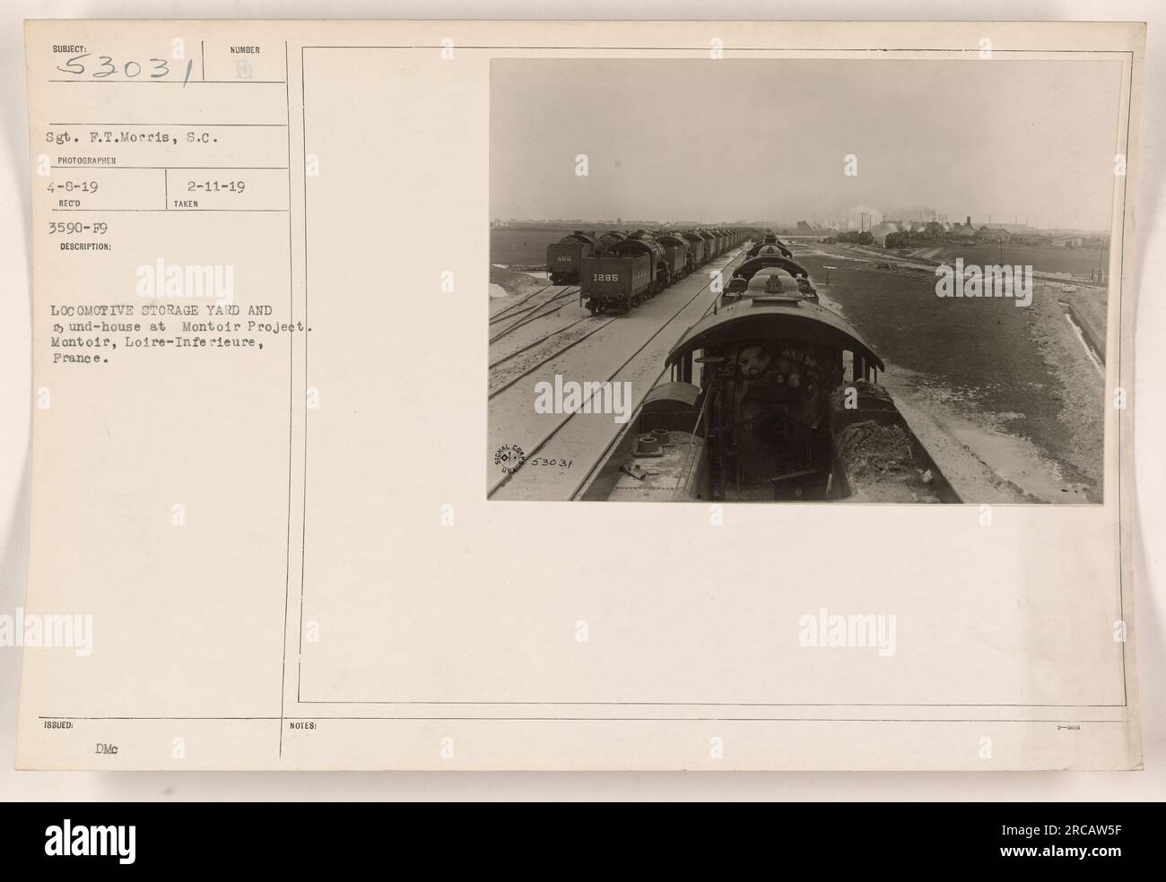 This image shows a locomotive storage yard and roundhouse at the ...