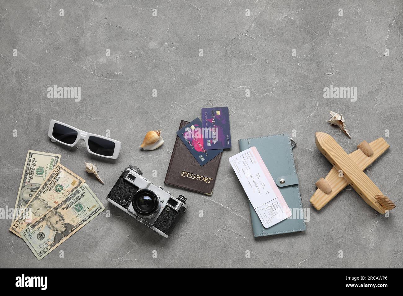 Composition with credit cards, ticket, photo camera and sunglasses on ...