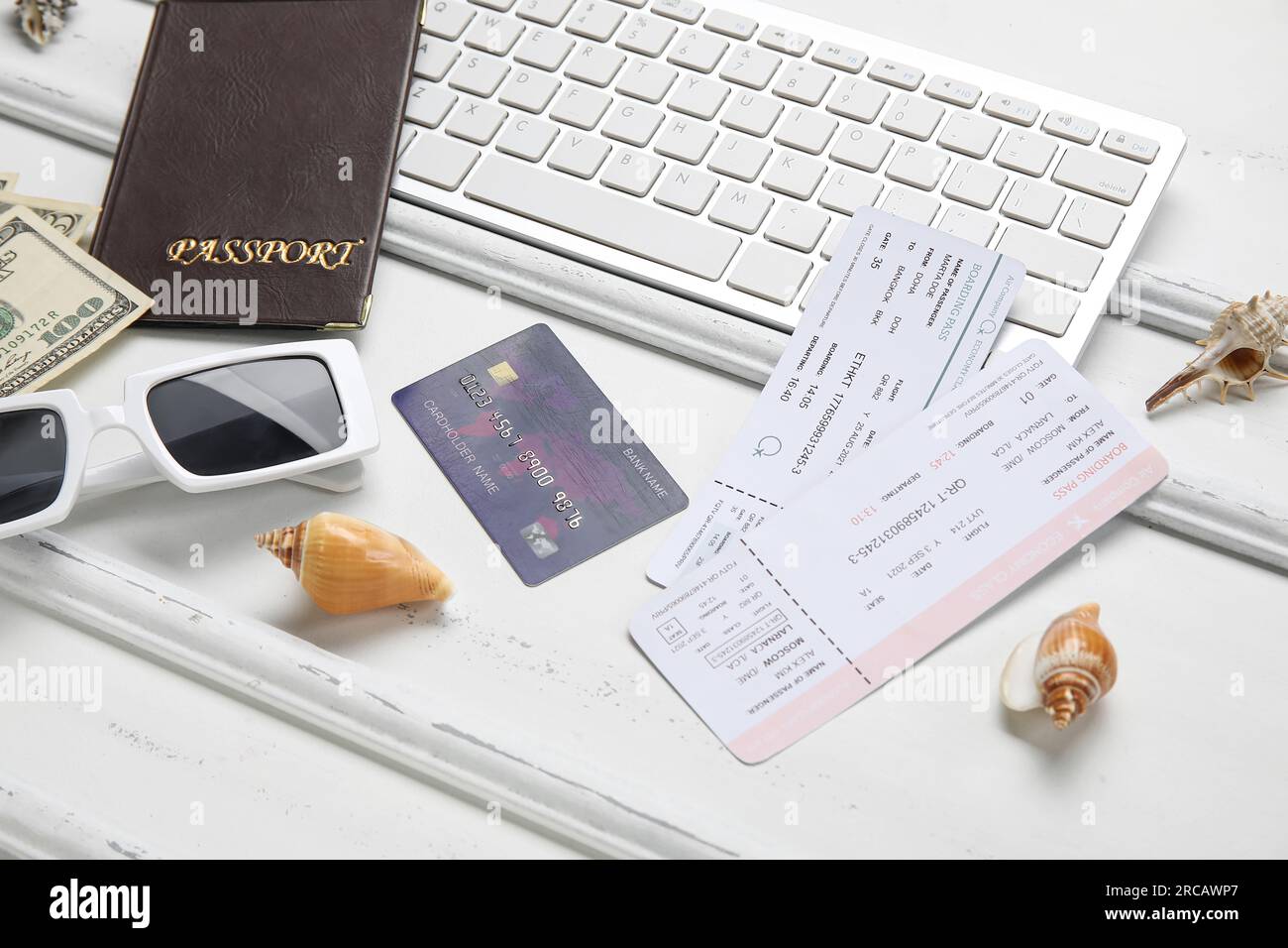 Tickets, credit card, keyboard and passport on light background Stock ...