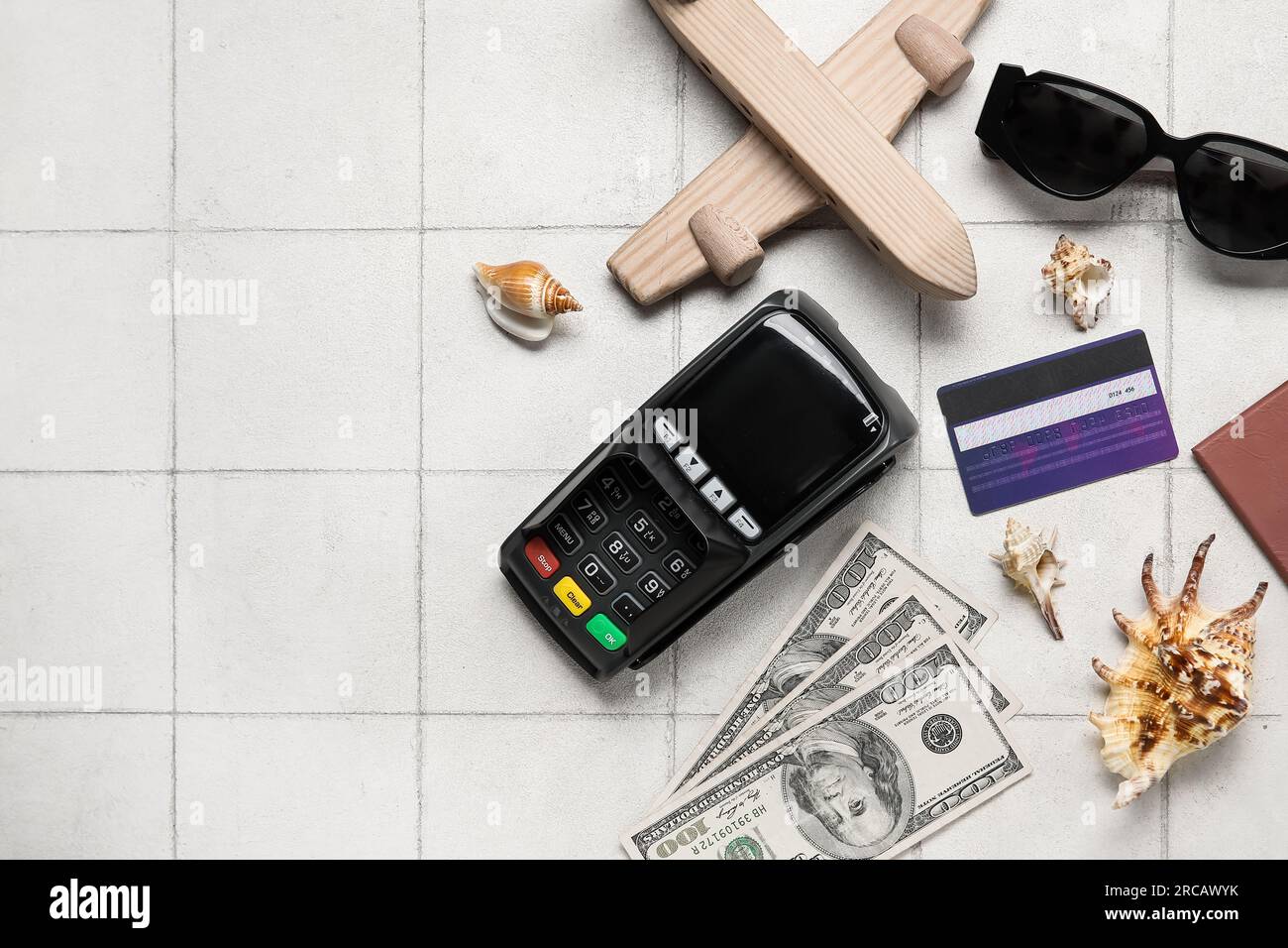 Composition with credit card, payment terminal, money and wooden plane ...