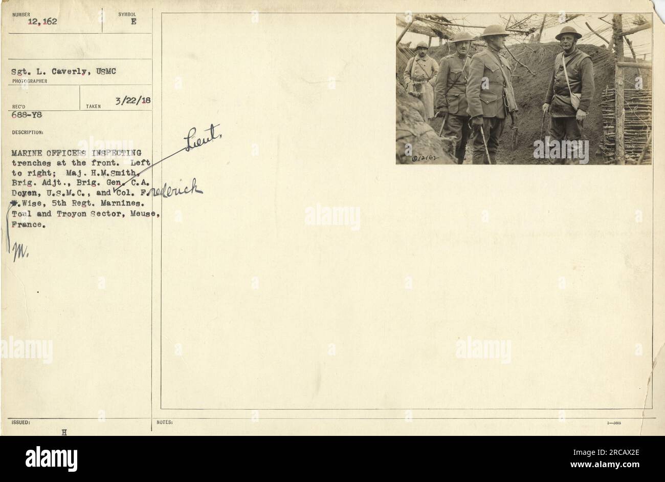 Sgt. L. Caverly's photograph captures Marine officers inspecting ...