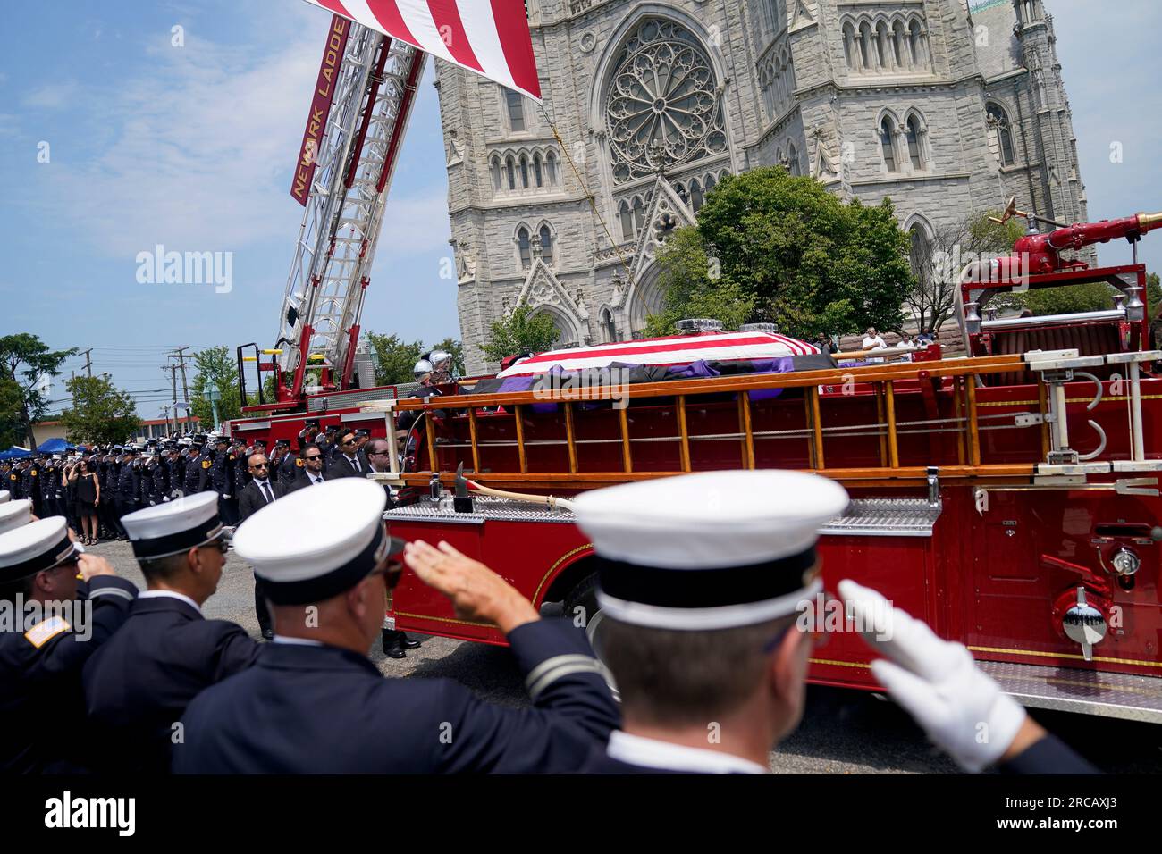 The casket of Newark firefighter Augusto "Augie" Acabou departs aboard ...