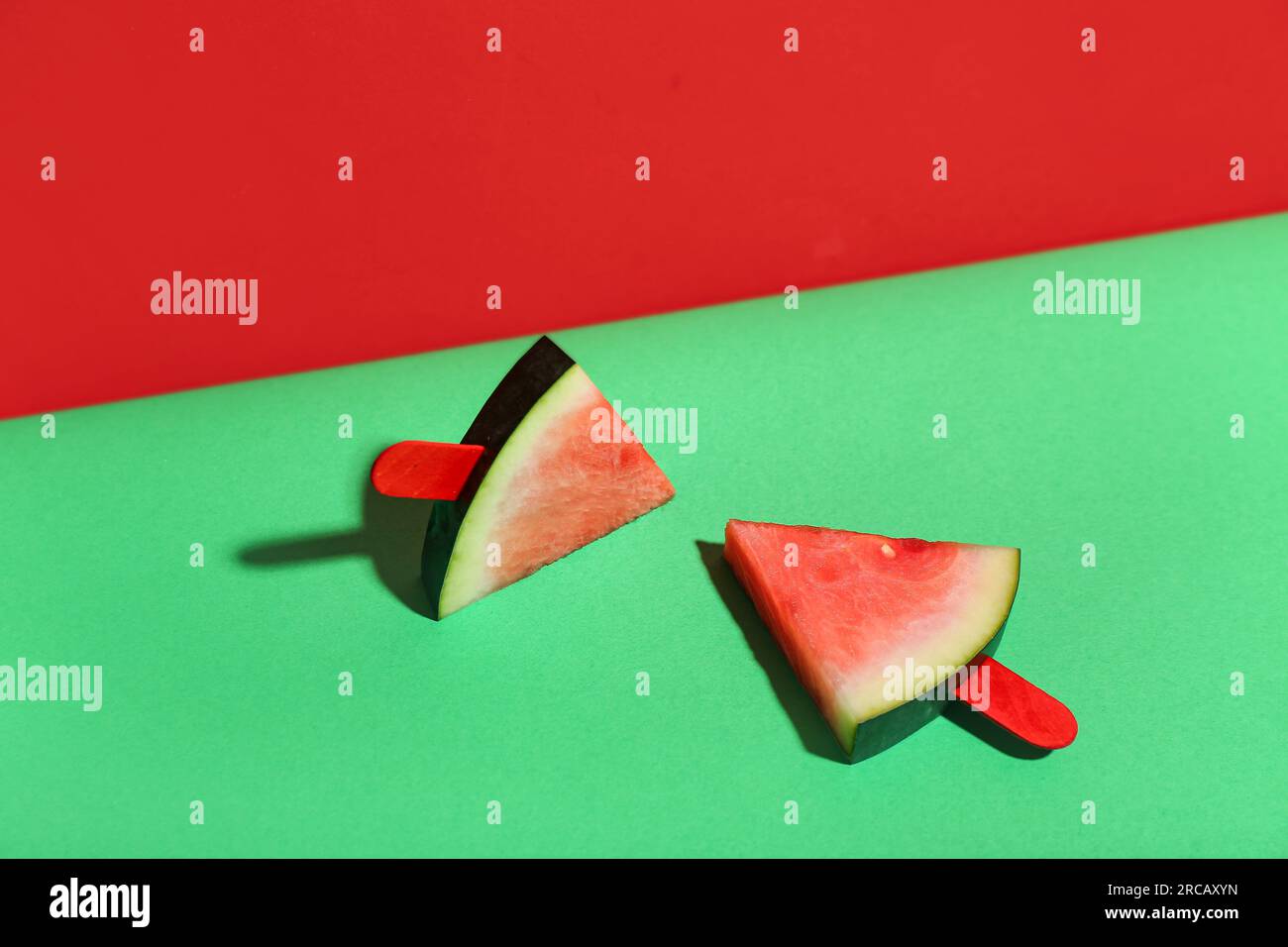 Sweet watermelon sticks on colorful background Stock Photo - Alamy