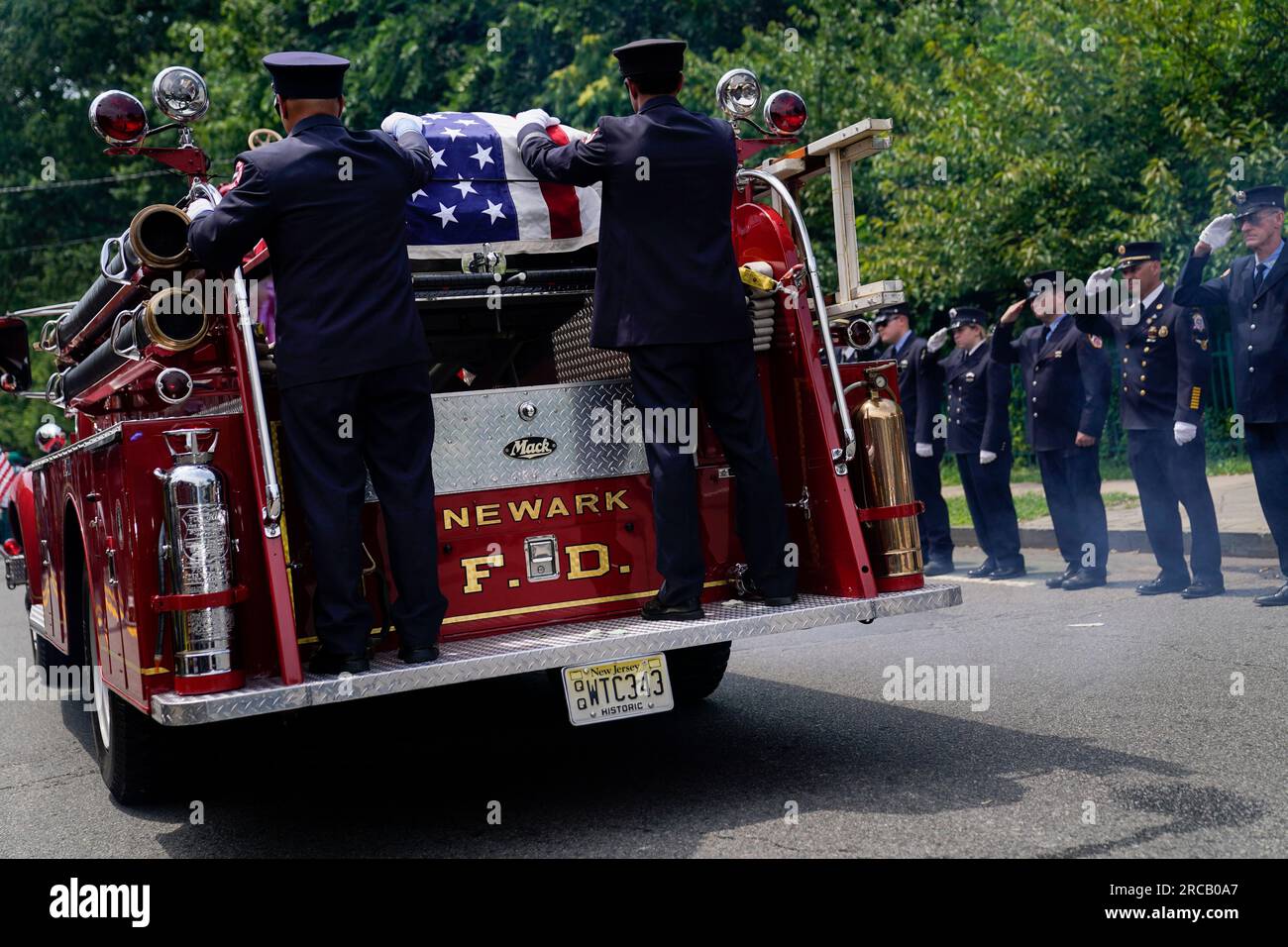 The casket of Newark firefighter Augusto "Augie" Acabou departs aboard ...