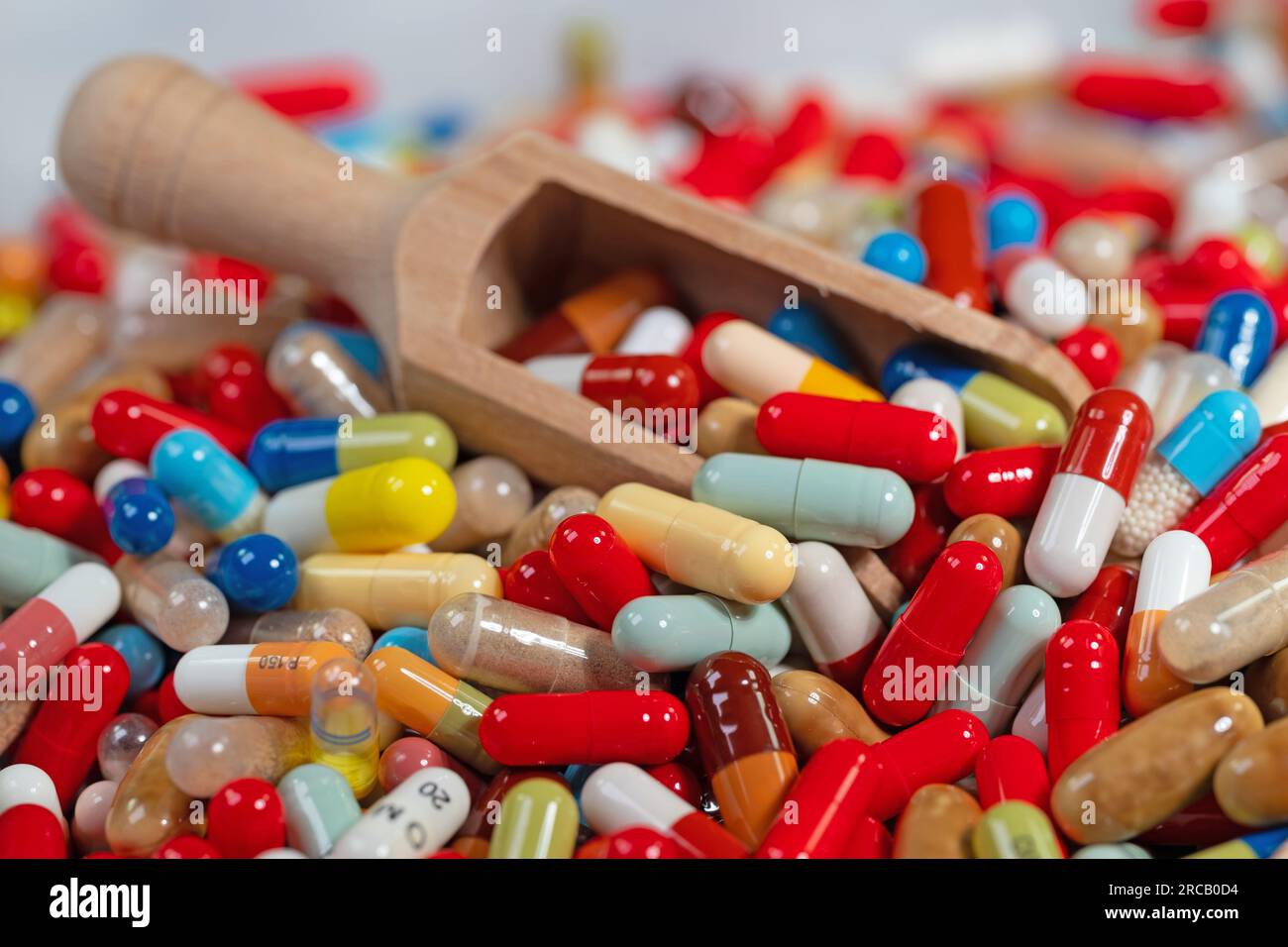 Many colorful capsules and tablets in a closeup Stock Photo - Alamy